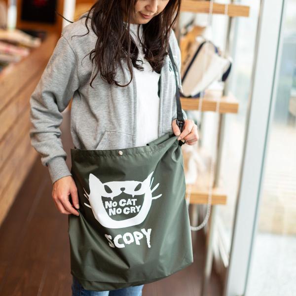 「NO CAT NO CRY」猫よ泣かないで。（マーリーリスペクトデザイン！）泣いているような、叫んでいるような猫の表情が特徴的なバッグです。【商品カテゴリ】  猫 ねこ リップショルダー マルシェバッグ オリーブ ネコ 猫柄 猫雑貨 猫グ...