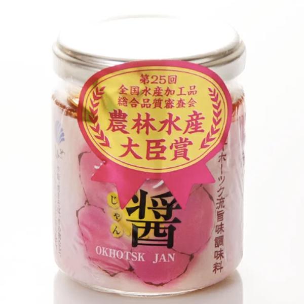 しんやのオホーツク高級素材たっぷりのうま味調味料【商品名】オホーツク醤（ジャン）【内容量】８０g×３個【原材料】植物油（サラダ油、ごま油、ラー油）、鮭フレーク、人参、帆立干貝柱、昆布、玉ねぎ、ニンニク、はまなすピューレ、食塩、香辛料、砂糖、...