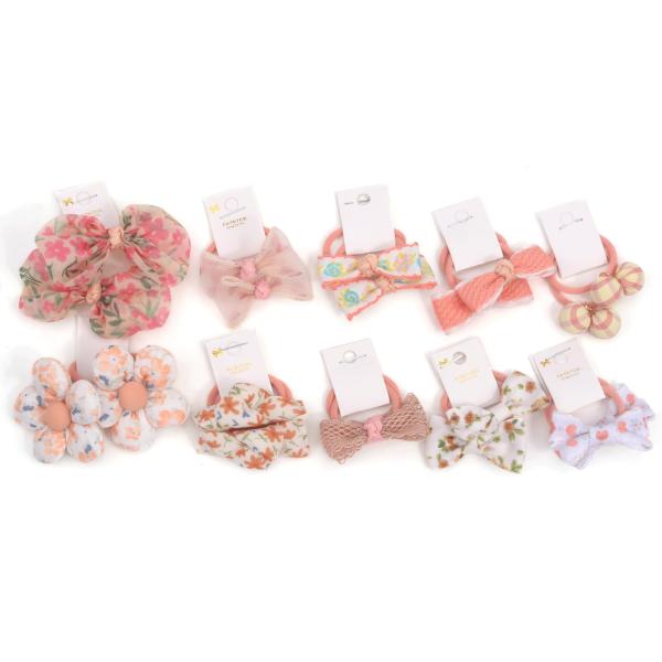 ・カラフル E  ・・Color:カラフル E・セット内容20本セット・デイリー使いにピッタリなヘアゴムセットです。・1週間ファッションにあわせてを付け替えるをコンセプトに それぞれ20本セットになっています。・どれもリボンと花柄を主とした...