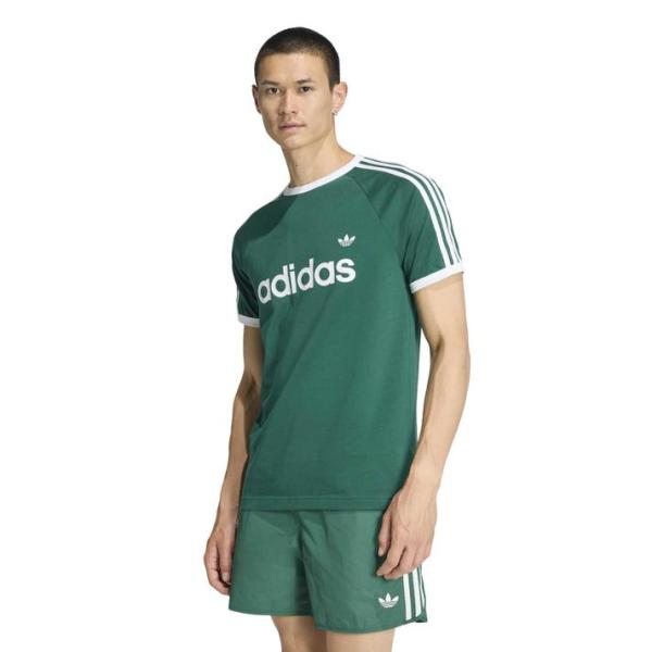 サッカー界のアイコンたちの活気に満ちたエネルギーにインスパイアされたスリーストライプス スリム リンガー Tシャツは、スポーツとスタイルを融合させる。大胆なディテールとスリムなシルエットで、毎日安心して快適に過ごせる。装飾を削ぎ落したフィー...