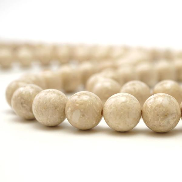 天然石名：リバーストーン 天然石英名：Riverstone商品形状：連売り ビーズ径 12mm ※ビーズ径+-0.5mmカラー：モニターの発色具合によって実際のものと色が異なる場合があります。ハンドメイドのブレスレット・アクセサリーや雑貨作...