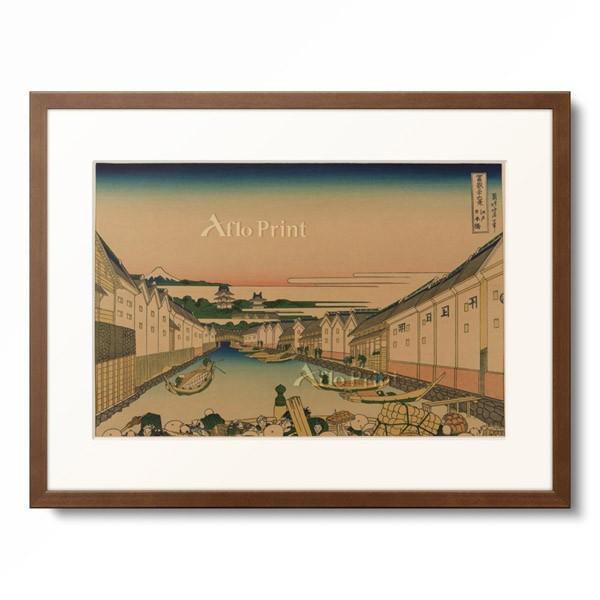 Hokusai Katsushika, 1760-1849.Print shows pedestrians and porters crossing the Nihon Bridge with view from the bridge of...