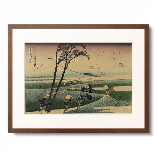 Hokusai Katsushika, 1760-1849.Print shows travelers struggling against strong winds near the Ejiri station on the Tokaid...