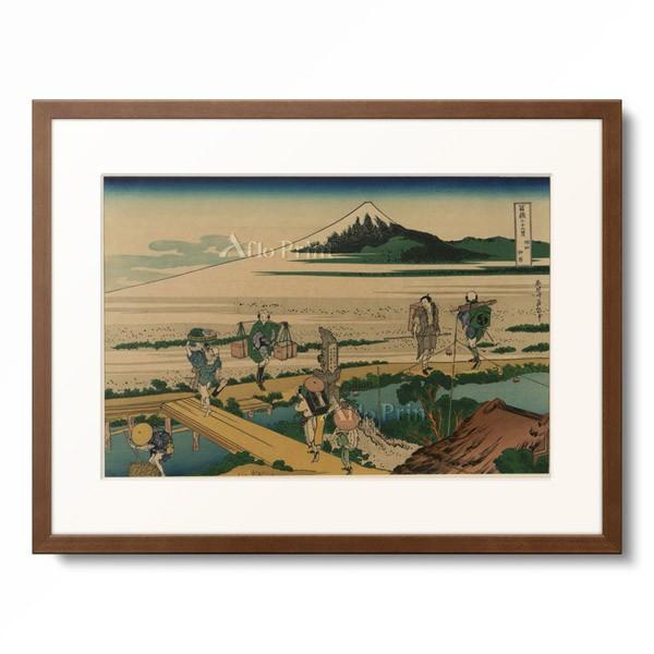 Hokusai Katsushika, 1760-1849.Print shows porters carrying bundles from a boat or warehouse (with thatched roof) at the ...