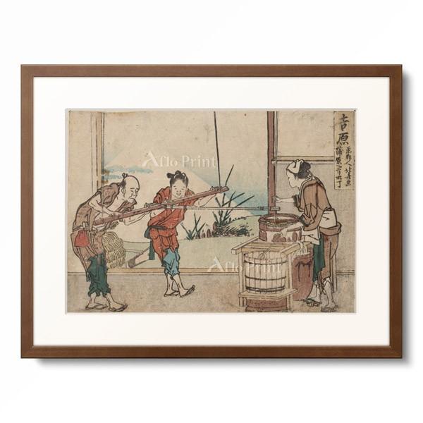 Hokusai Katsushika, 1760-1849.Print shows an older man and two young apprentices, possibly women, manually operating a s...