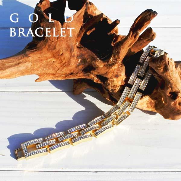 キラキラとゴージャス感のあるおしゃれなブレスレットです！ずっしりと重くかっこいいデザインです。チェーン幅が太く、目立つこと間違いなし！存在感があります。■チェーンカラー：ゴールド■実寸サイズ全長：約22.4cm(留め具含む) 幅：約1.5c...