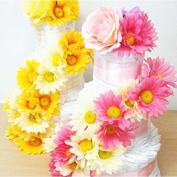 ３段おむつケーキ ガーベラフラワー【当店人気】出産祝い 男の子　女の子【土曜日】3段インスタ映え★ベビーギフト おしゃれ 売れ筋　セレブ Sassyダイパーケーキ おむつタワー ひまわり クリスマス ベビーシャワーサクラ