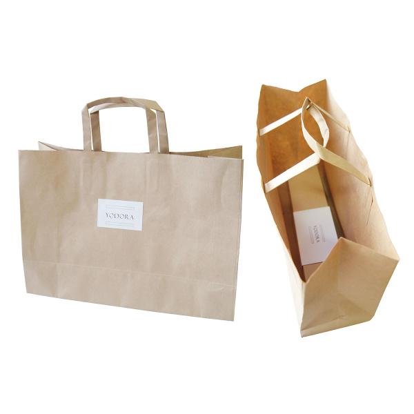 YODORAをもっと華やかに。専用紙袋で贈る特別なひととき。洋風どらやき『YODORA（5個入り化粧箱）』に最適な、専用手提げ紙袋です。YODORAのシンボルマークをあしらった上品なデザインで、大切な贈り物をより美しく、印象的に演出します。...