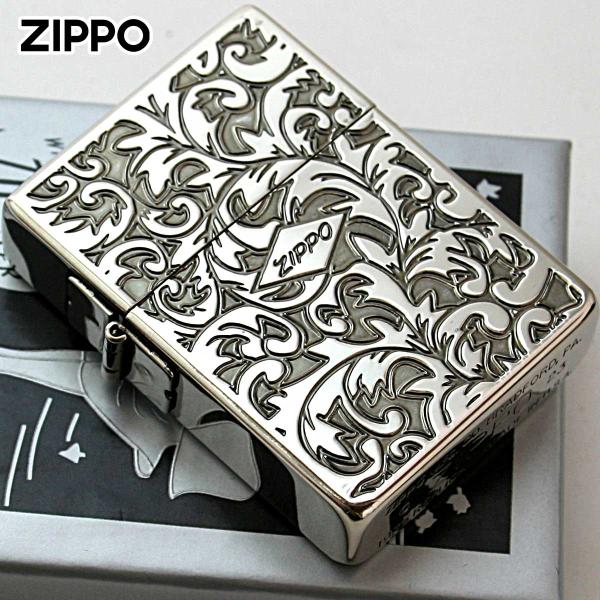 1935レプリカがベース、当時の形状の特徴であるブラス材を輪切りにしたようなスクエアケースに、専用のインサイドユニット、ダミーではない本物の3バレル外ヒンジ、フリントホイール部の中空リベット。両面にアラベスク柄を加工、表面の中央にZIPPO...