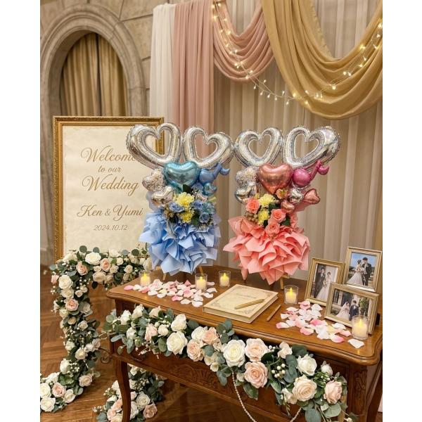 卓上バルーンスタンドは、ピンクとブルーの２色カラーセットで特別なイベントを華やかに彩ります。ドレスのような豪華さを持ち、発表会や結婚式などの特別なシーンに最適です。バルーンと造花の組み合わせが、視覚的なインパクトを与え、祝福の場を一層引き立...