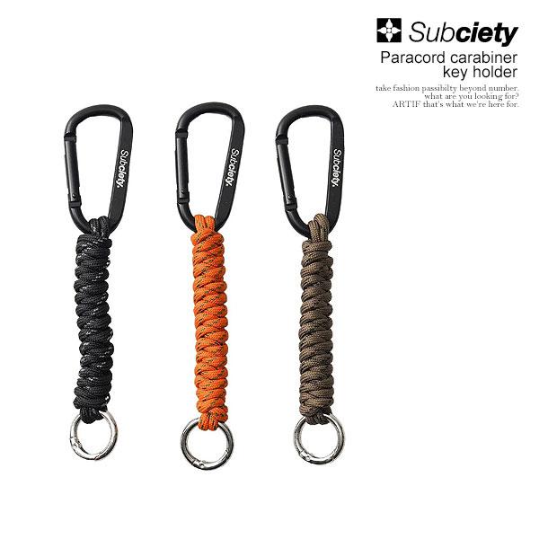 【発売日：2026年02月15日】SUBCIETY サブサエティ●商品説明カラビナとパラコードを組み合わせた機能性の高いキーチャーム。アウトドアの雰囲気を演出するパラコードをスネークノットで採用し、両端にD型カラビナ、丸型カラビナを配備。上...