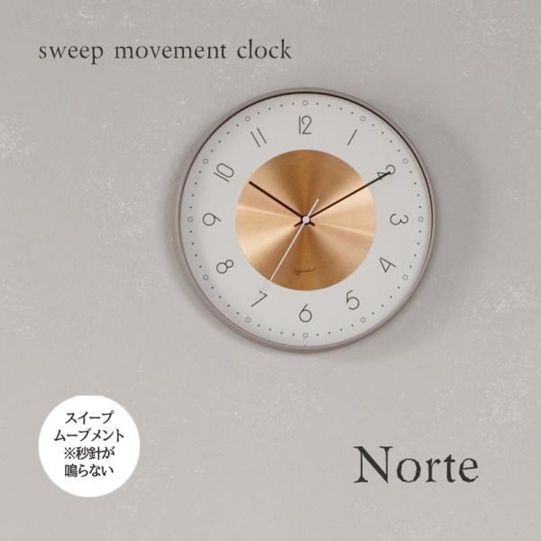 中央にあしらわれたコッパーのプレートがさりげなく輝く壁掛け時計。ウォームグレーのスリムなフレームと、フェミニンな文字盤がマッチした上品なデザインです。※壁掛け用木ネジ付。単三電池は別売りです。※コチコチ音が気にならないスイープムーブメントを...