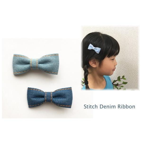 厚手のしっかりしたデニム生地を使ったリボン。ビンテージオレンジのステッチがポイントになっています。お洋服の色を選ばない、シンプルで使いやすいクリップです。・リボンの直径 5.5cm - 6.0cm・クリップ部分のサイズ　4.5cm × 1c...