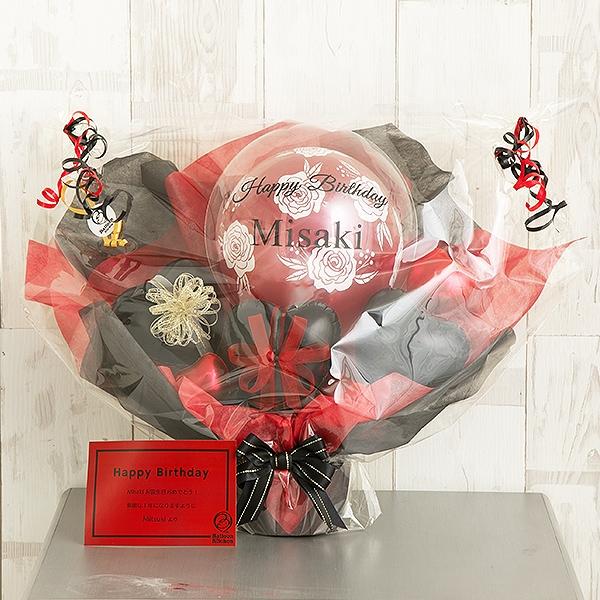 赤と黒のバルーンとリボンの組み合わせがセクシーで、かっこいいバルーンポット。中央にローズカラーのローズ柄のバルーンを配置して。マットなブラックカラーが赤色をさらに映えさせます。ゴールド、赤のリボン遣いでより華やかに。贈る相手やお店の雰囲気に...