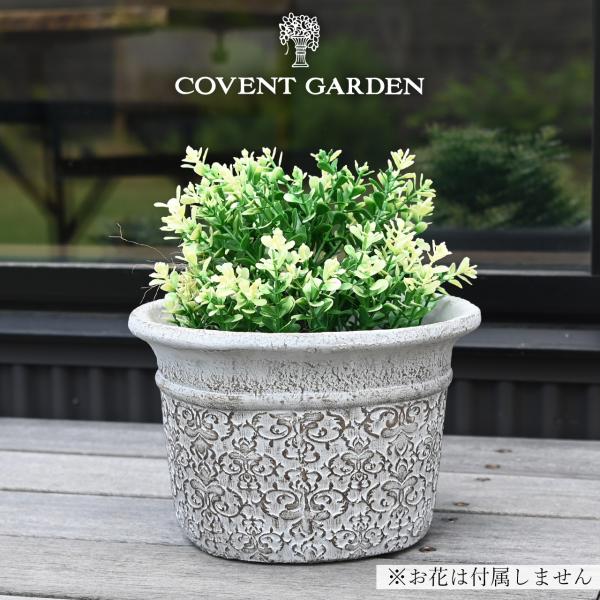 グレーの器にブラウンのボタニカル柄が映えるオシャレな植木鉢です。素材はセメントでずっしりと重厚感があるので、高級感を感じさせてくれます。全体に擦れや色ムラをつけてアンティーク風に仕上げており、グリーンを優しく引き立てお庭になじみます。白やピ...