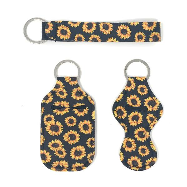 ・ブラック ひまわり アクセサリー セットは、女性の必需品です。すべてのアイテムは厚手のネオプレン製です。・各フローラルセットにはリストランヤード、ハンドサニタイザーホルダーキーチェーン＆リップクリームホルダーキーチェーンが含まれます。・リ...