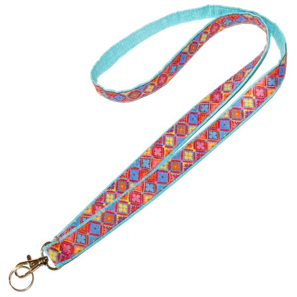 ・A jewel toned embroidered ribbon creates a gorgeous way to carry keys or an ID badge. This 3/4 inch wide strap is decor...