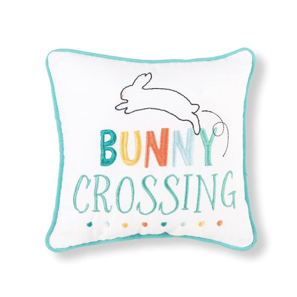 ・DESIGN: Playful embroidered pillow features charming "BUNNY CROSSING" text with "BUNNY" in cheerful multicolor letters ...