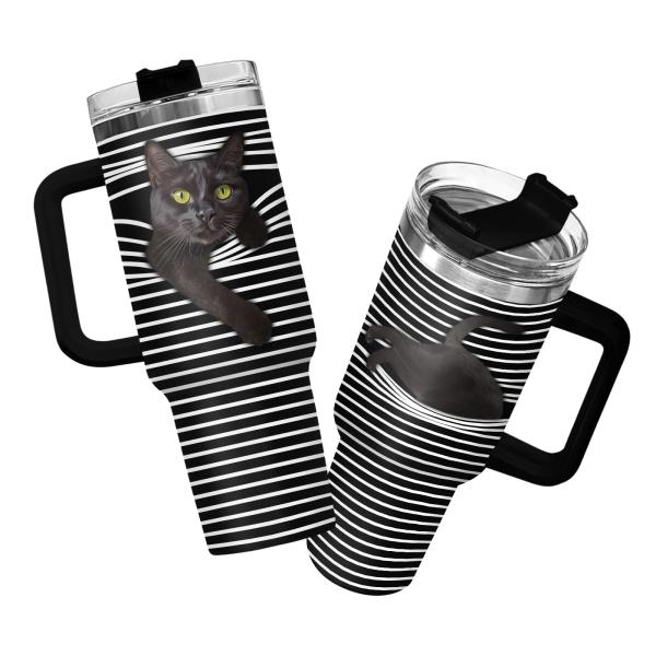 ・Playful optical illusion design featuring a black cat with vivid green eyes peeking through bold black-and-white vertic...