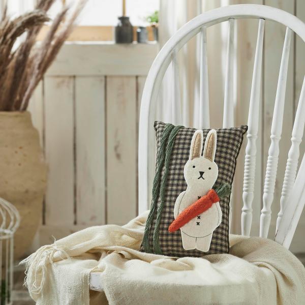 ・Delightful Design: This pillow showcases an antique-style bunny in natural white felt, clutching a vibrant orange carro...