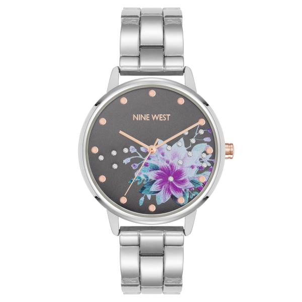 ・Mineral crystal lens・Grey textured dial with floral design and 14 clear genuine crystal accents; rose gold-tone hands a...