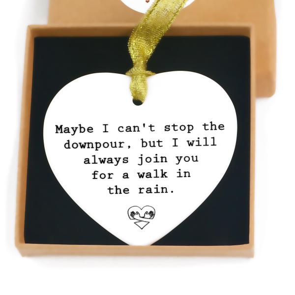 ・Best Friend Gifts for Women: This sympathy gift bears the heartfelt message "Maybe I can't stop the downpour, but I wil...