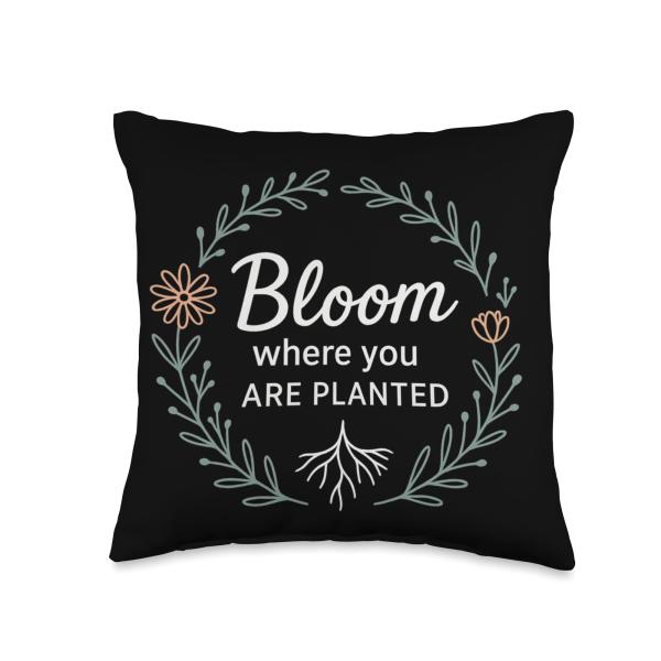 ・Elegant wildflowers design with soft pink daisies and a glowing script that reads "Bloom where you are planted" for a c...