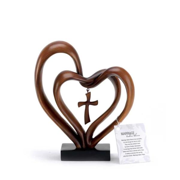 十字架と絡み合ったハートの置物中央に十字架がぶら下がった2つの絡み合ったハートが描かれています結婚生活の中心にキリスト(神)を置くための素晴らしい象徴的なリマインダーです結婚には3人必要という詩が書かれたハングタグが付属しています結婚祝いに...