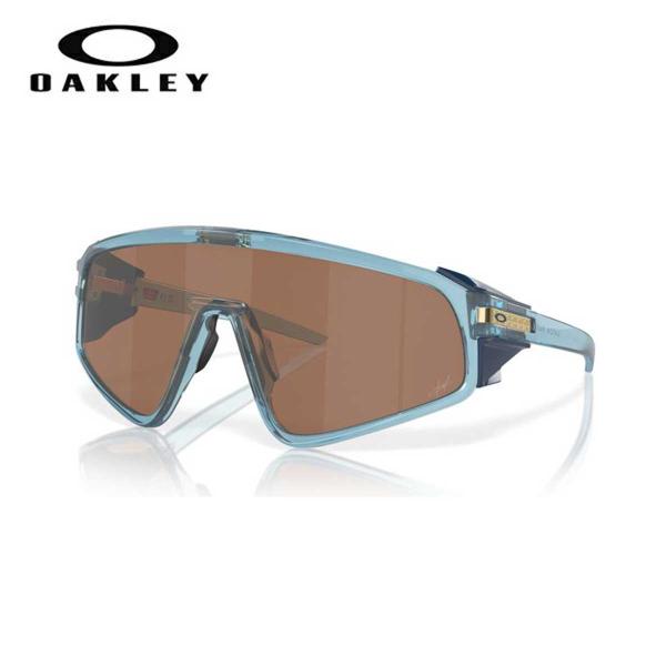 OAKLEY オークリーサングラス■Latch Panelフレームカラー：レンズカラー■TRANSLUCENT STONEWASH : PRIZM TUNGSTEN/可視光線透過率: 14%日照状況: 明るい光ベース レンズ カラー: ブロ...
