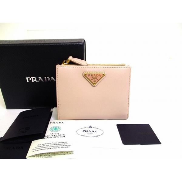 【未使用保管品】 PRADA プラダ サフィアーノ トライアングル シティ カーフレザー 2つ折り 財布 コンパクト財布 コンパクトウォレット メンズ レディース未使用保管品の為とても綺麗なお品です（新品同様の状態ですが、未開封の新品ではな...