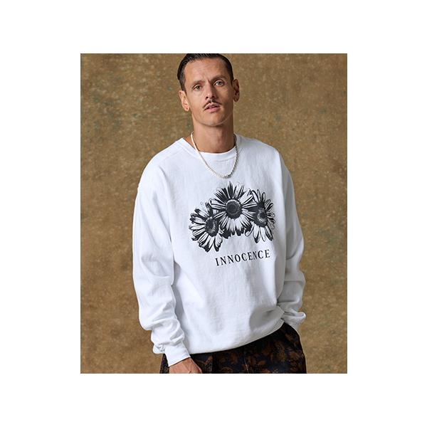 ピグメント加工（顔料染め）を施したスウェットに”デイジーの花”をプリントしたヴィンテージライクCNスウェット。ヴィンテージのHIPHOPTeeをデザインソースにデイジーの花言葉である”純潔/innocence”を添えたグラフィックデザイン。...