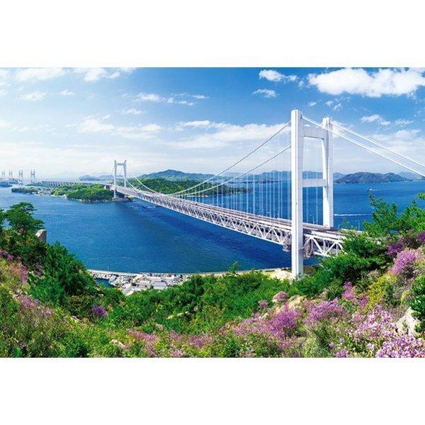 サイズ：26x38cm300ピース瀬戸大橋は、昭和63年に開通した世界最大級の道路・鉄道の併用橋です。道路37.3km、鉄道32.4kmで、吊橋、傾斜橋、トラス橋など島々を渡る橋梁を総称して瀬戸大橋と呼ばれます。日本の20世紀遺産20選に選...