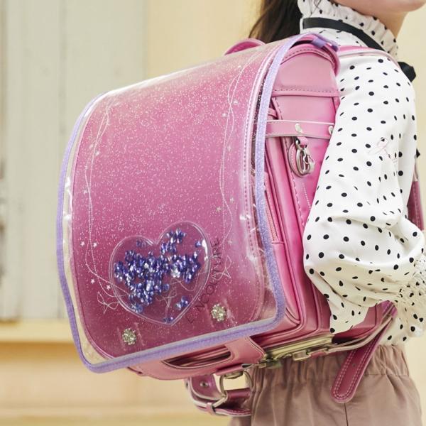 【チャオバンビーニ限定販売!!】キラキラのフチテープを使用し、もっとキラキラシャイニーでオシャレ度UP♪中央のハート型の中にキラキラ２色のスパンコール入り!!本体の透明生地は透明度の高い素材を使用し、キラキララメも入れました♪反射材も付いて...