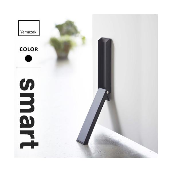 片足でサッと押し下げてドアを固定。使わない時は折り畳んでスリム。■ 対応サイズ磁石のくっつく平らな面のスチール製ドア※ ドア下部と地面との間が10cm以上あるドアには取り付けられません。■ サイズ（W×D×H)4.5×3.5×16cm■ 商...