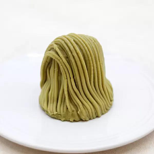 【地域限定送料無料】(※北海道・沖縄・一部離島等除く) 業務用食品サクサクのクッキーの上に、口どけのよいホイップクリームと白餡とピスタチオペーストを混合したモンブラン餡を絞りました。ピスタチオナッツの風味豊かなモンブランケーキです。＜アレル...