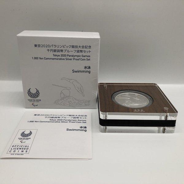 品名:平成31年 東京2020パラリンピック競技大会記念千円銀貨幣プルーフ貨幣セット「第二次・水泳」質量:31.1g直径:40.0mm品位:純銀図案:（表）水泳　（裏）東京2020パラリンピック競技大会エンブレムとソメイヨシノとイチョウの葉...