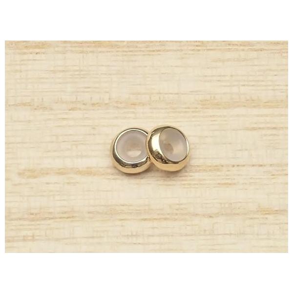 特記すべき項目※表面に細かいキズが見られる場合がございます。材質14KGF（14金ゴールドフィルド）サイズ約6.5-7.5×2.7mm（±0.3mm）穴径約2.5mm数・量2コ販売になります関連ワード14KGFパーツ スライドボール スライ...