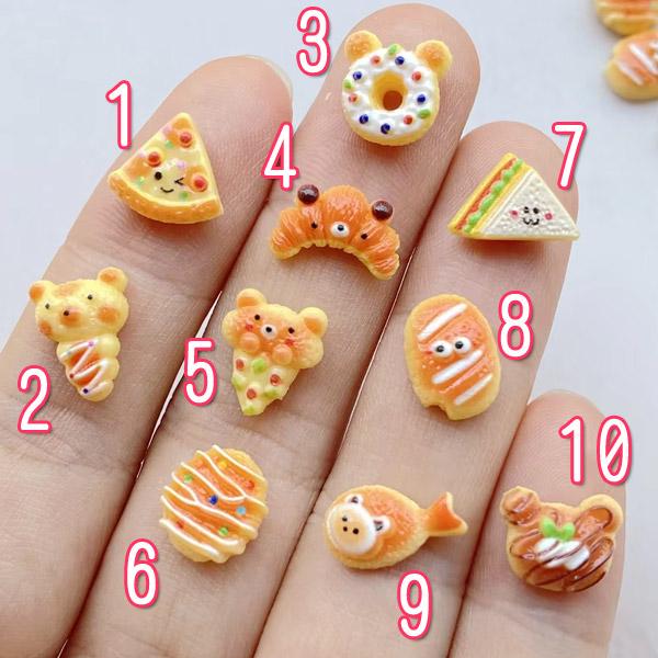 パンのデコパーツです！ネイルサイズなのでネイルにも、小さいデコレーションにもお使いいただけます♪パン、ピザ、ドーナツなどなど、色々ご用意できました♪1種類を5個セットでの販売となります。【販売単位】5個【サイズ】縦横ともに概ね8から12mm...
