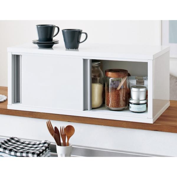 【幅60cm 標準タイプ】光沢仕上げ 水ハネ対応引き戸カウンター上収納庫 キッチン用品収納 シンク 水周り  爆買 ディノス dinos 人気 おしゃれ前後から出し入れ可能。引き戸タイプで場所をとりません。水ハネに強い素材で汚れもサッとキレイに。
