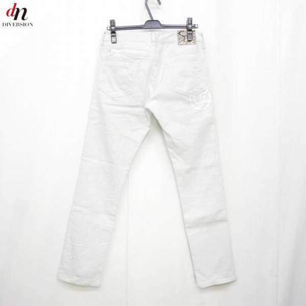 [管理番号] DNS-3328[ブランド名] uniform experiment (ユニフォームエクスペリメント)[アイテム名] SLIM-FIT STRETCH RIGED JEANS (PYTHON PATCH) (SWAROVSKI...