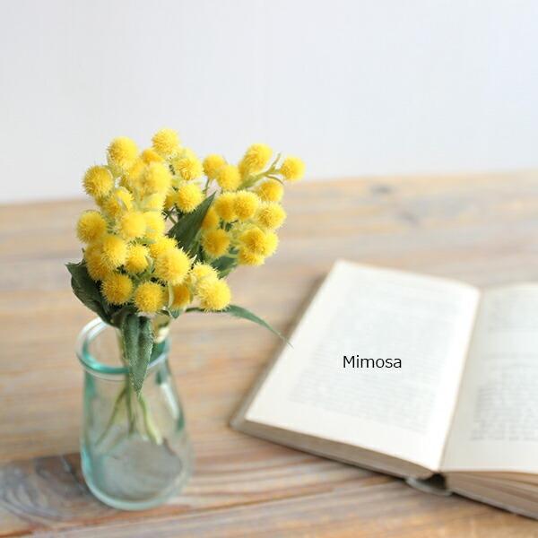 ちいさなポンポンみたいな黄色いミモザ♪元気なイエローカラーは、ミモザだけでも他のお花やグリーンとでも可愛らしい♪写真の花器、グリーンなどは、別売りとなります。■ミモザ　１束３本（造花・未触媒）■サイズ 全長 19cm  花径 約0.7cm ...