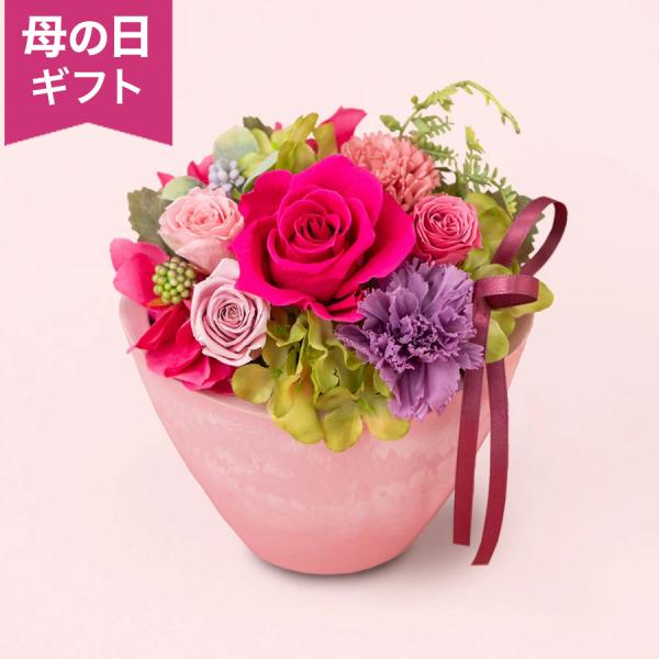 いつまでも輝いていてねの気持ちを込めて…。2種類のカーネーションを使ったアレンジメント美しく開花したフューシャピンクのバラと、「気品」の花言葉を持つ紫色のカーネーションが目を惹くアレンジメントです。ピンク、パープル、グリーンを組み合わせた優...