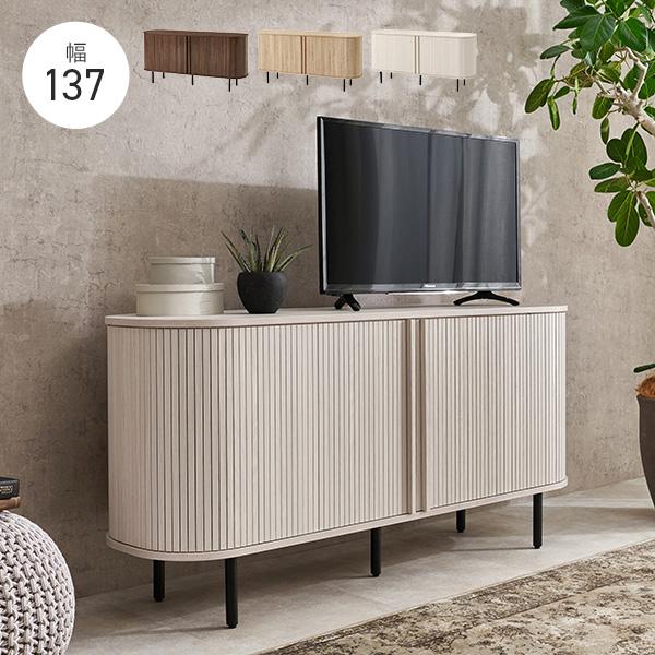 曲線と陰影が美しいタンブールドアのテレビ台。タンブールドアとは、蛇腹のように細板が連なって折り畳める構造で、美しさと実用性を兼ね備え、古家具にも用いられているデザインです。スチール脚がシャープでモダンな印象を与えつつ、木目調がウッディな柔ら...