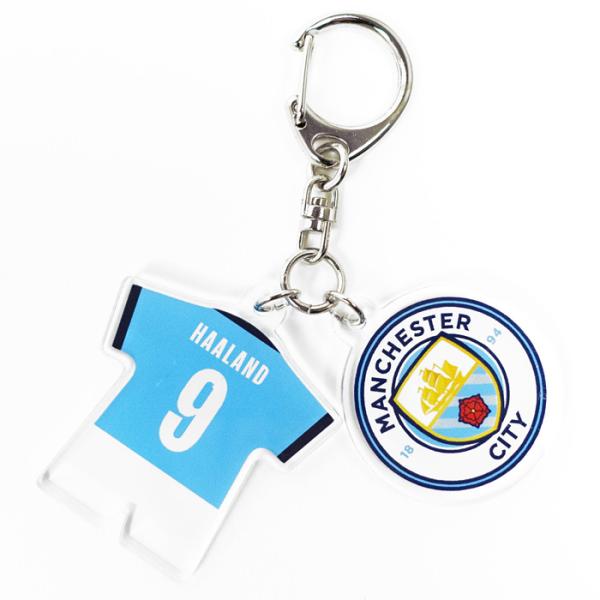 マンチェスター・シティのアクリルキーホルダー。ユニフォームとエンブレムの2連チャーム。No.9 アーリング・ハーランドのデザイン。※国内ライセンス商品■サイズ：4.0×4.0cm（ユニフォーム部）/3.0×3.0cm（エンブレム部）■素材：...