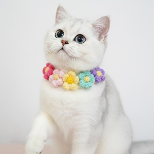 素材 ：毛糸カラー：白ベース、5色の立体の花飾り ：5色の立体感のある花モチーフ留め具：パールボタンサイズ：首回り約21〜27cm（※手作りのため若干の誤差があります）かぎ編みで丁寧に手作りしました。温もりあふれるやさしい雰囲気の猫首輪です...
