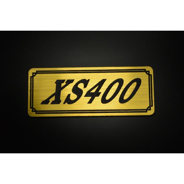 ヤマハXS400【商品詳細】・サイズ： 縦：2cm×横5cm×厚み0.1cm・色： 金/黒・個数：1枚・素材：アクリル2層ステッカー・質感 背景／地肌・・レーザー加工によるマットブラック ロゴ部・・ヘアラインゴールド。・マットブラック部には...
