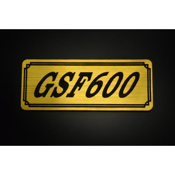 スズキGSF600【商品詳細】・サイズ： 縦：2cm×横5cm×厚み0.1cm・色： 金/黒・個数：1枚・素材：アクリル2層ステッカー・質感 背景／地肌・・レーザー加工によるマットブラック ロゴ部・・ヘアラインゴールド。・マットブラック部に...