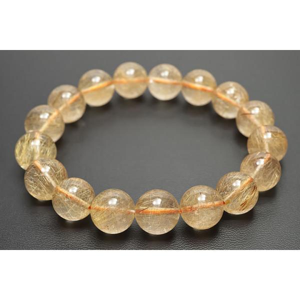 12mm玉×17個 手首周り:約16.5cm　オレンジ色のルチル水晶です。金や銀とは異なり、優しい色をしています。透明度の高い水晶に繊細で高貴なオレンジ色のルチルが内包されています。