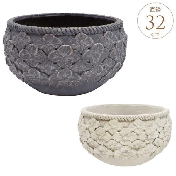 カラー:ブラック、ホワイト材質:グラスファイバーサイズ/重さ:直径320×高さ185mm　内径：265mm備考:側面に花弁をたくさんあしらっした華美なプランター。今まであるようでなかった、プランターが主役になれるとってもおしゃれなデザインで...