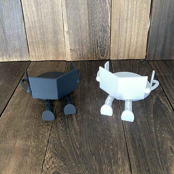 予備のトイレットペーパーを楽しく飾る読書するペーパーホルダートイレの片隅に置くだけで、狭い空間が楽しい場所に(^^)■カラー：ブラック/ホワイト■素材：プラスティック■サイズ：約15cm×約15cm×約8cm■重量：約73ｇ■生産地：中国※...